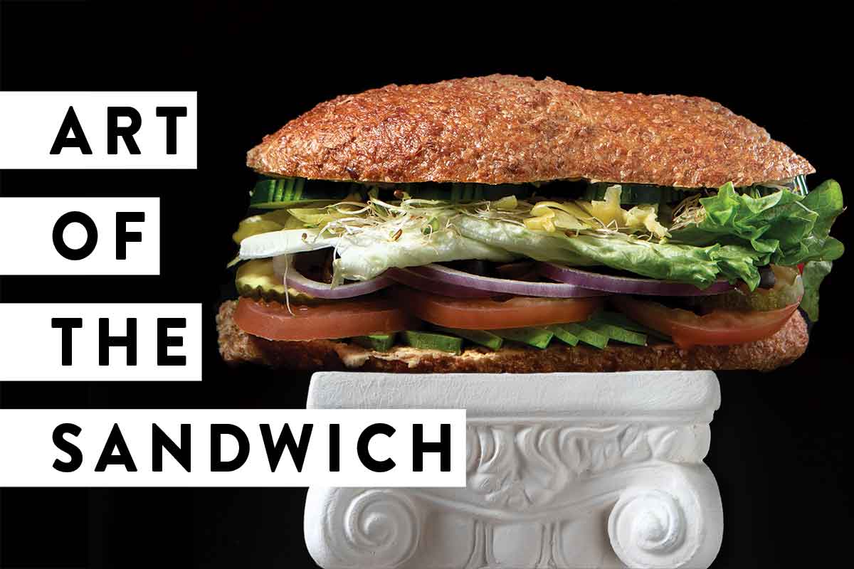 Art of the Sandwich text with a sandwich on a pedistal - Nugget Markets ...